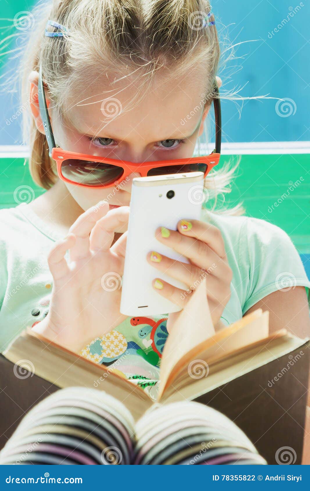 Girl Child with the Book and Phone. Stock Photo - Image of internet ...
