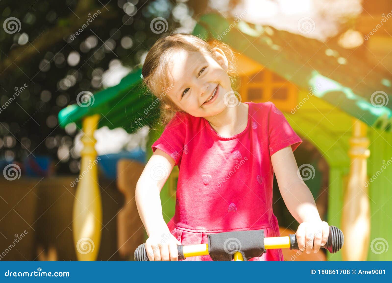 Girl Child Playing Outdoors Smiling into the Camera Stock Photo - Image ...