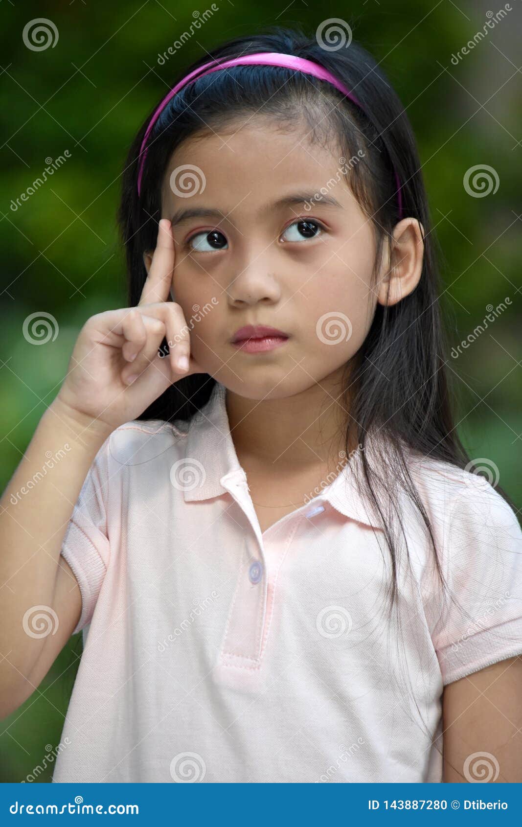 A Girl Child Thinking stock photo. Image of adorable - 143887280