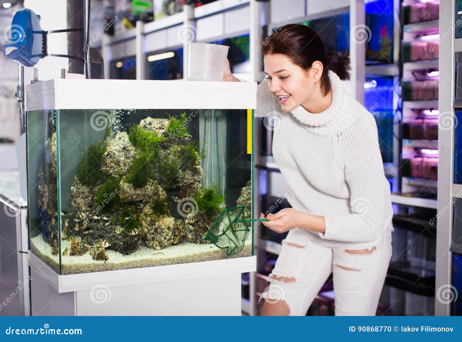 Girl Chooses the Fish that she Catches Stock Photo - Image of hold ...