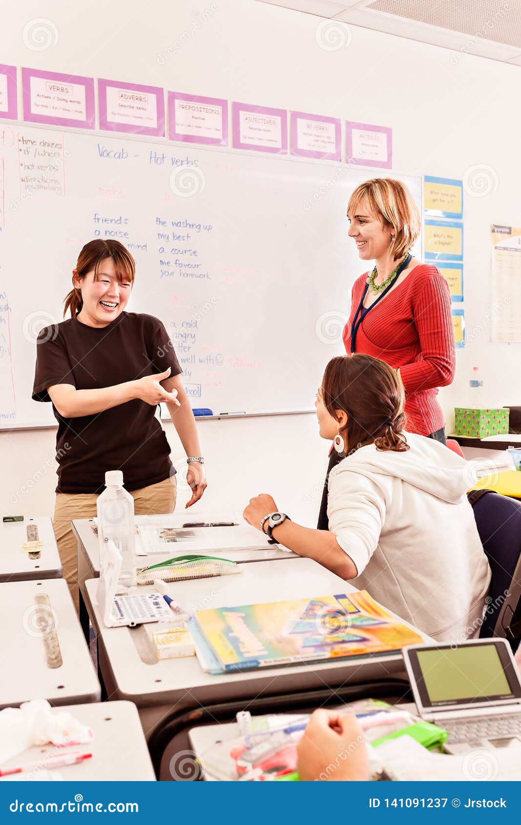 Girl in a Classroom Point at Another Student Stock Image - Image of ...