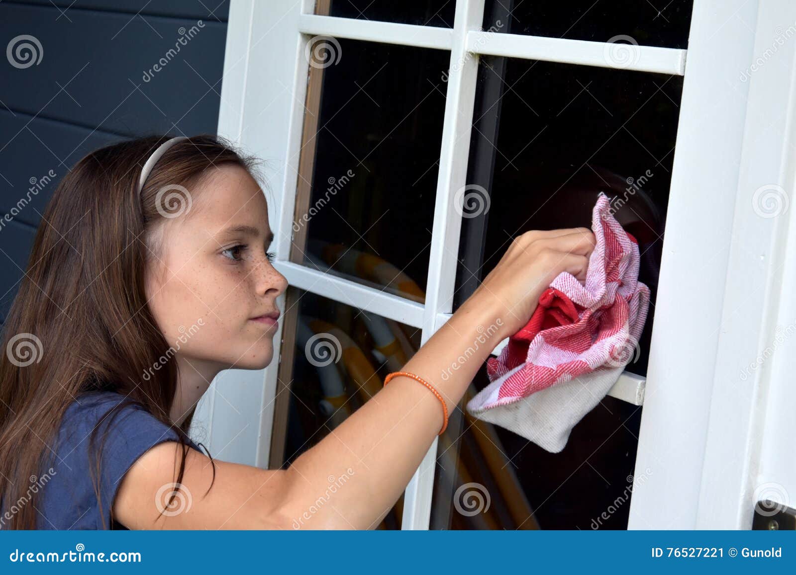 Girl cleaning windows stock image. Image of clean, housework - 76527221