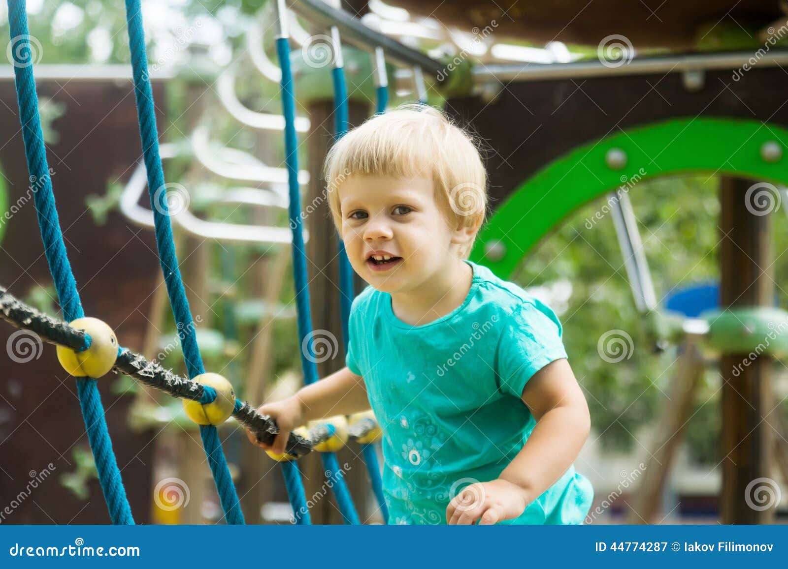 Girl Climbing the Ropes of Challenge Net Stock Image - Image of ...
