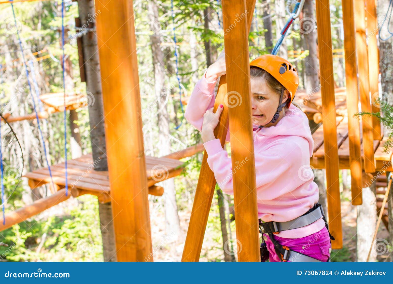 Girl Climbs into Ropes Course Stock Photo - Image of nature, forest ...