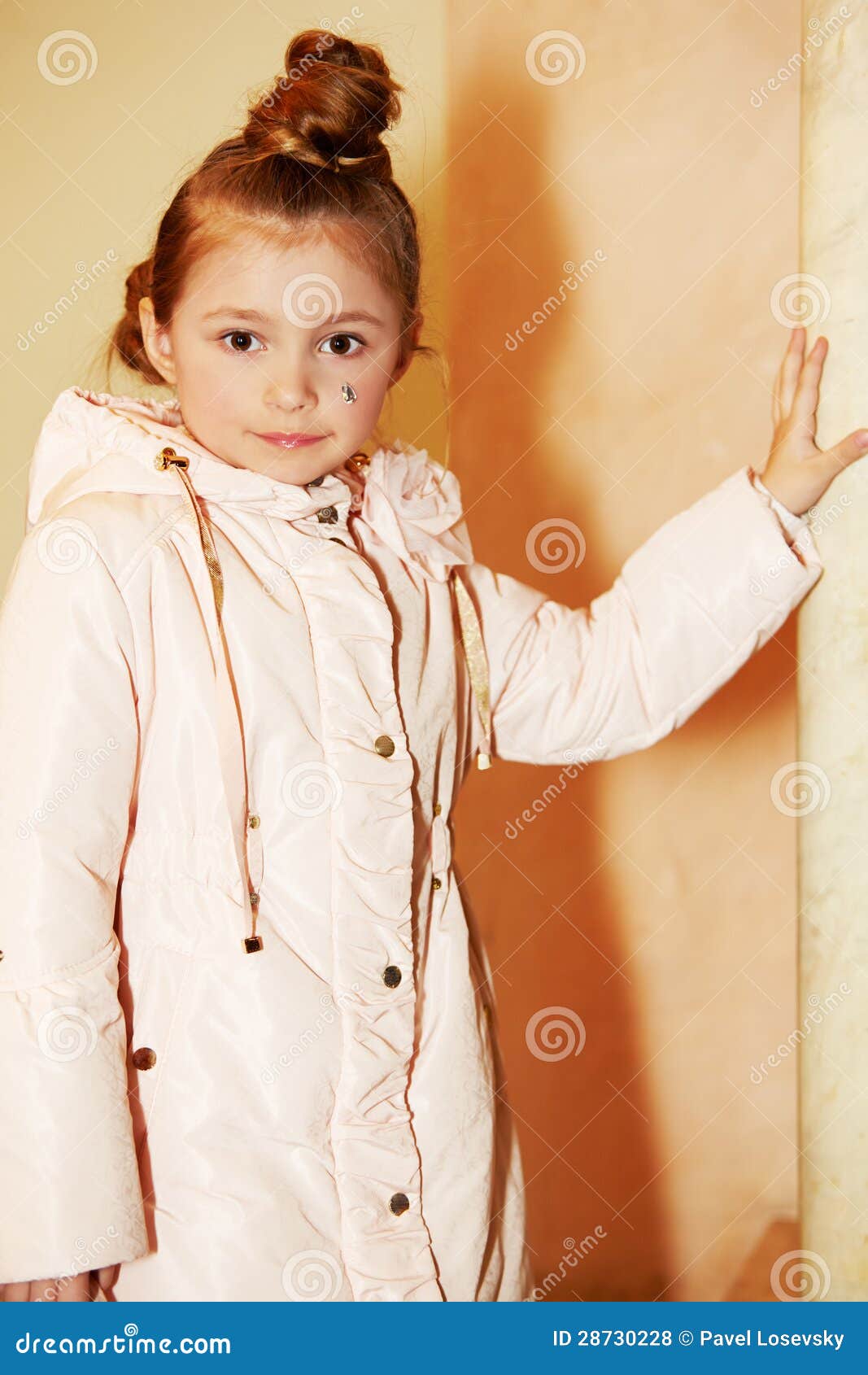 Girl in Coat Stands, Leaning One Hand on Pillar Stock Photo - Image of ...