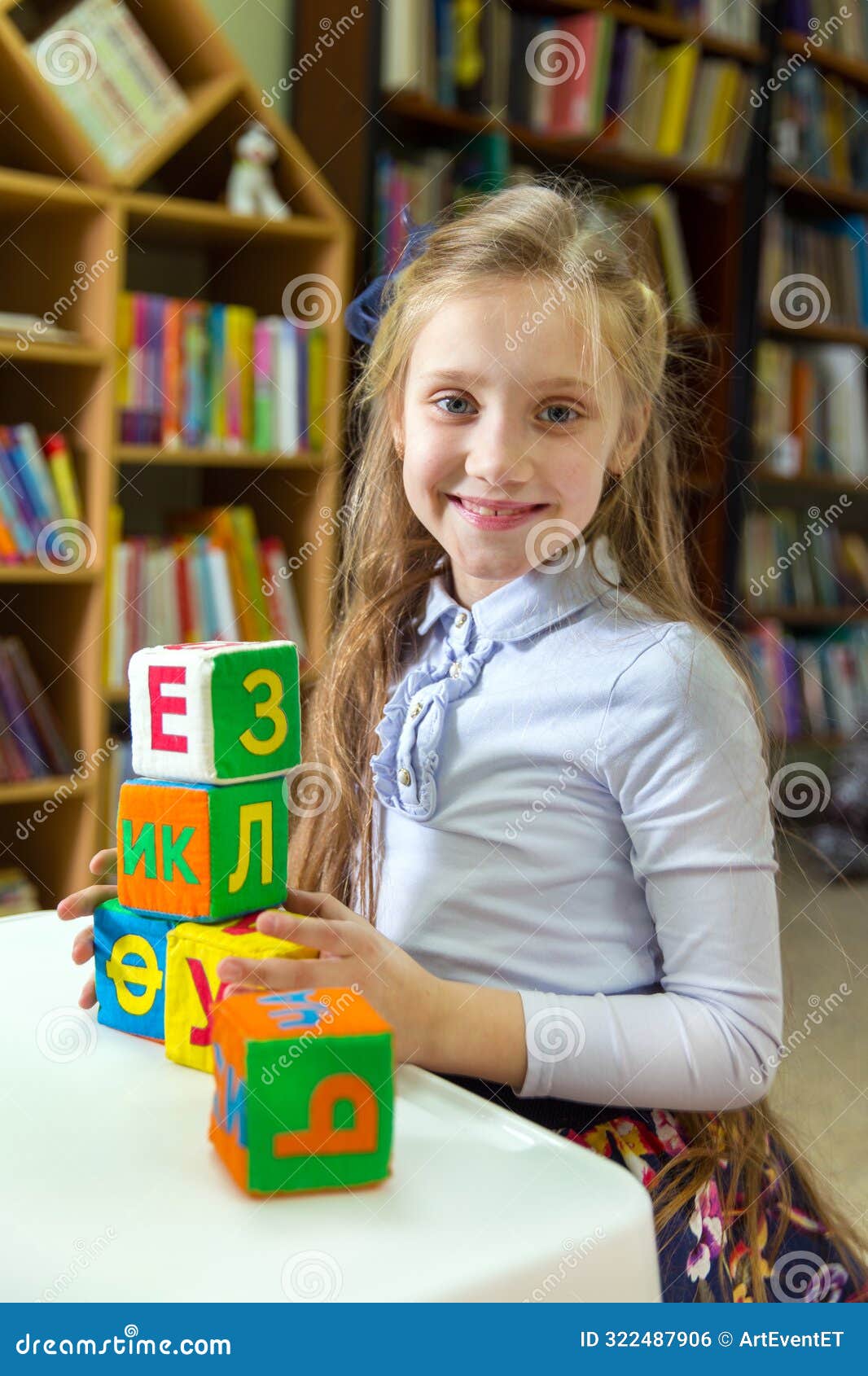 Girl Collects Alphabet Cubes into Stack Stock Photo - Image of ...