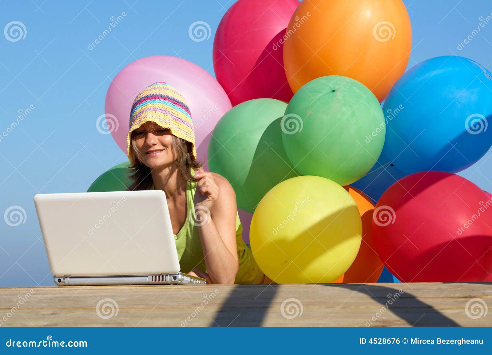 Girl with Colorful Balloons Using a Laptop Stock Photo - Image of ...