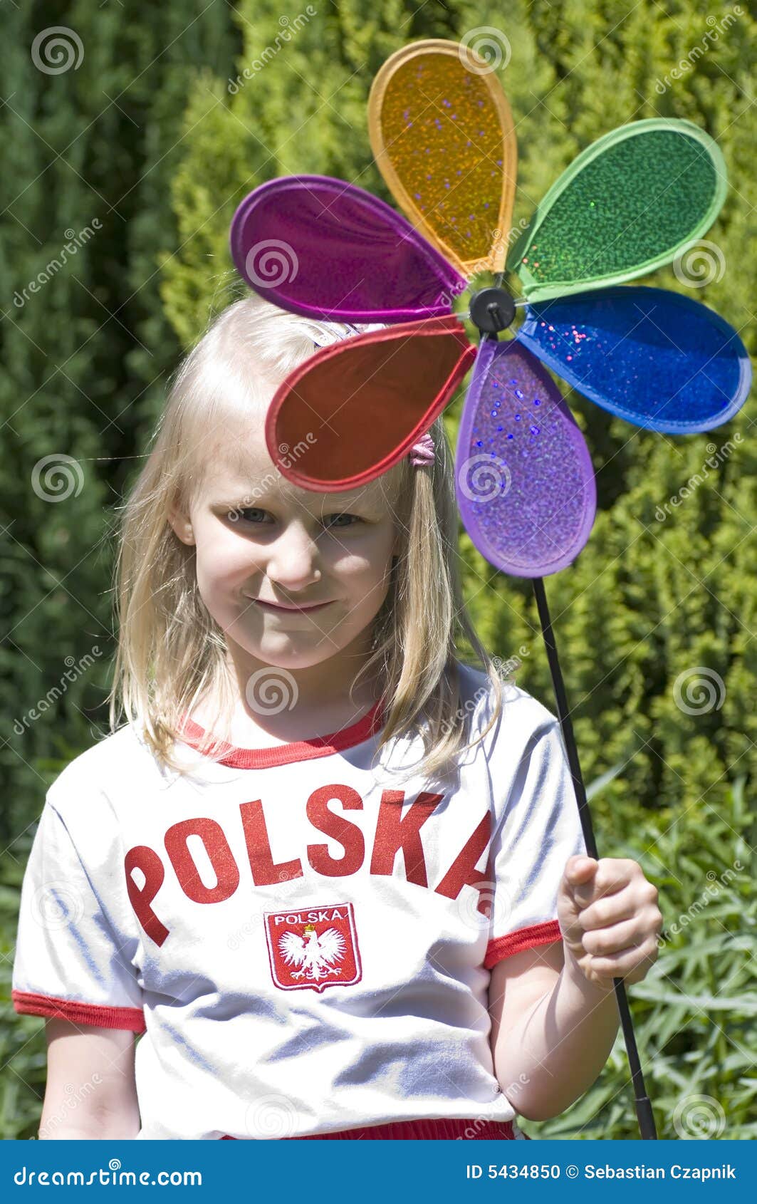 Girl with Colorful Pinwheel Stock Photo - Image of blur, child: 5434850