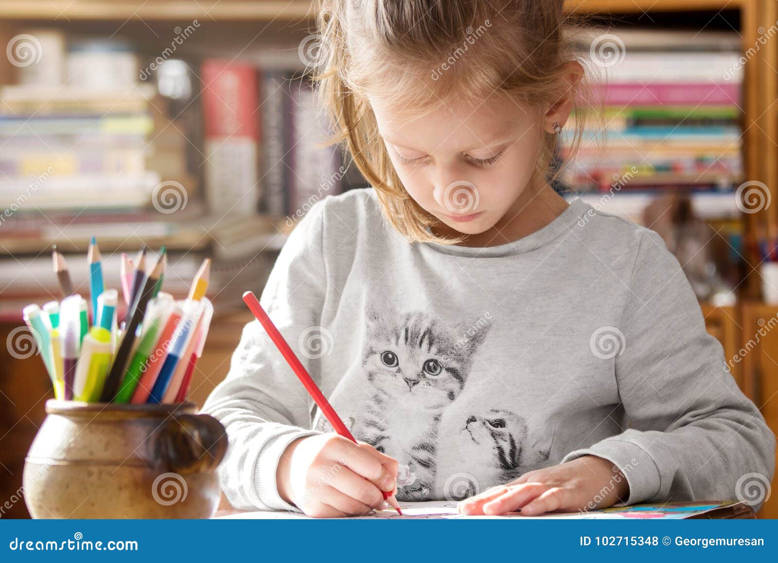 Girl Coloring in a Coloring Book Stock Photo - Image of paper, pencil ...