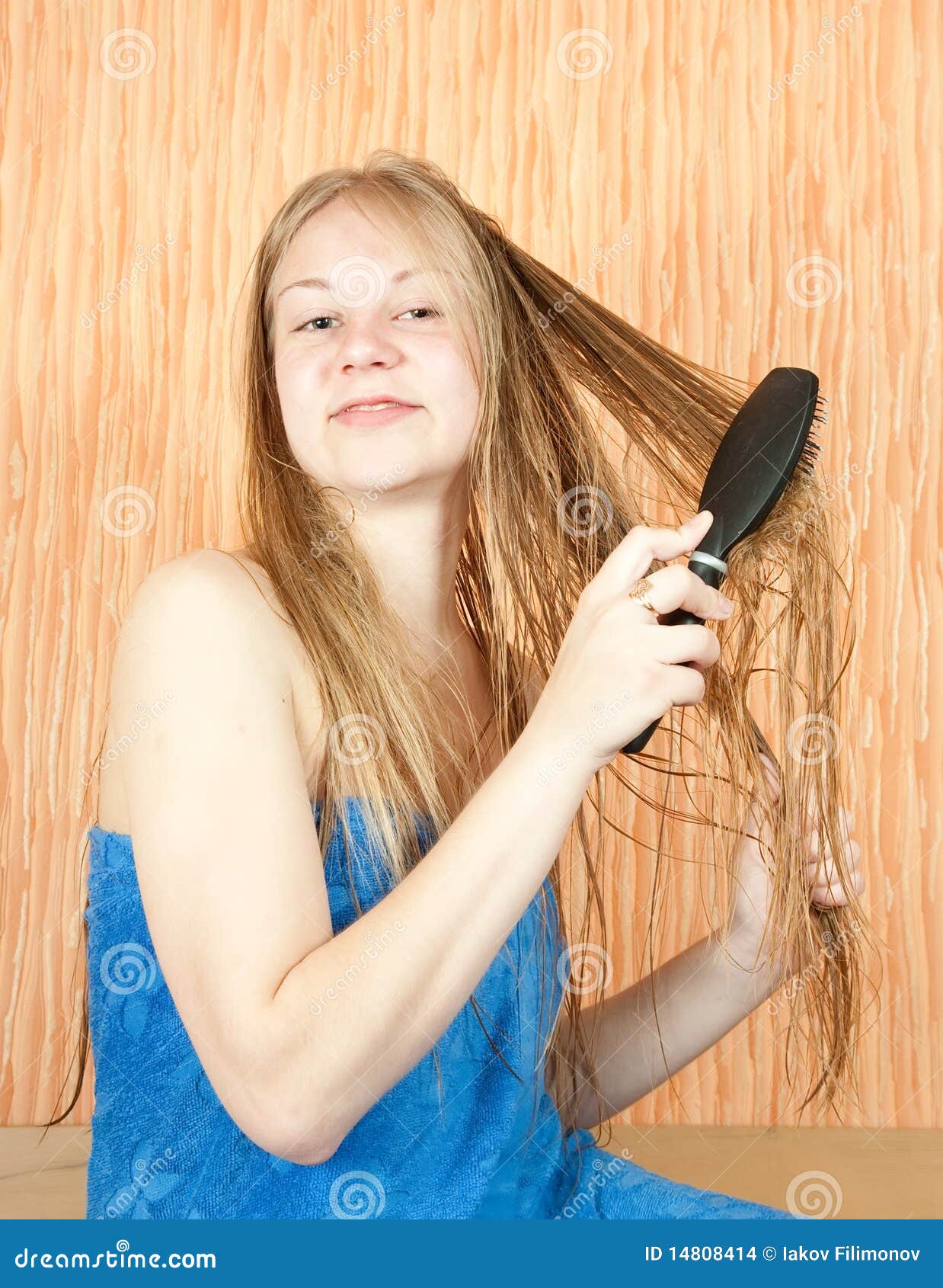 Girl combing her long hair stock photo. Image of home - 14808414