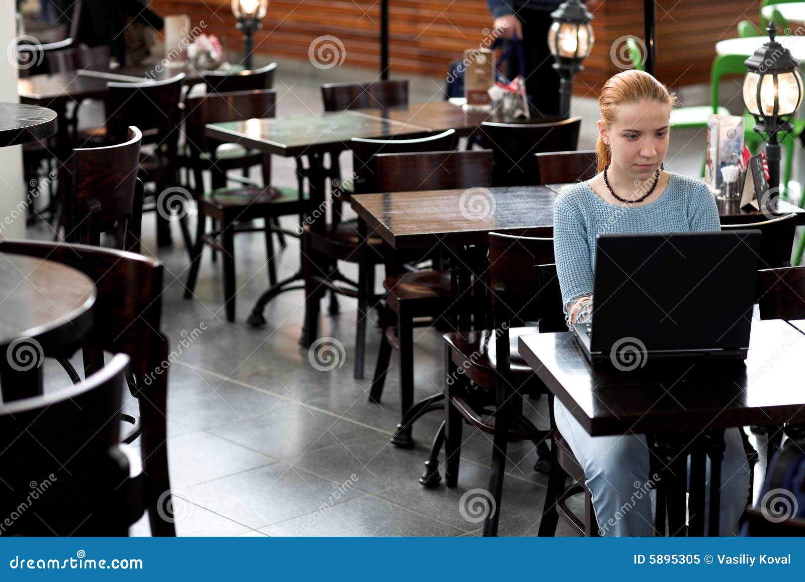 Girl with computer in cafe stock image. Image of desk - 5895305
