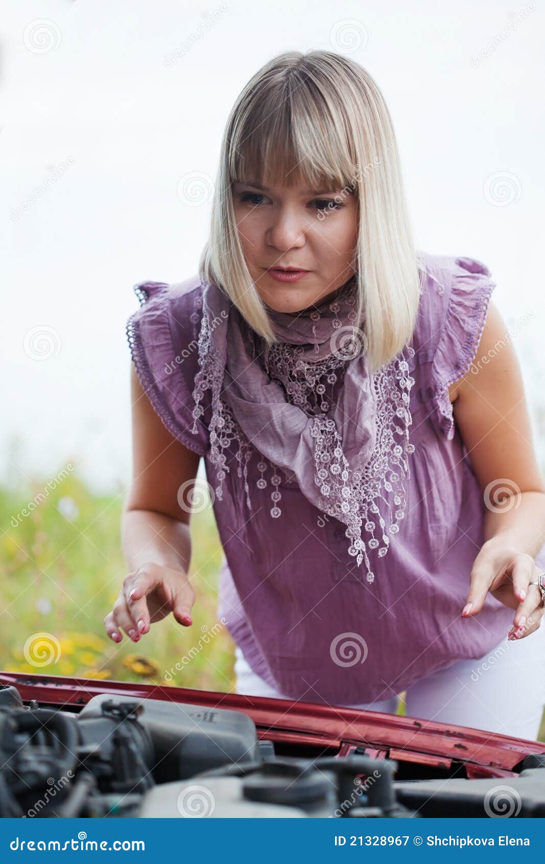Girl considers the engine stock image. Image of repair - 21328967