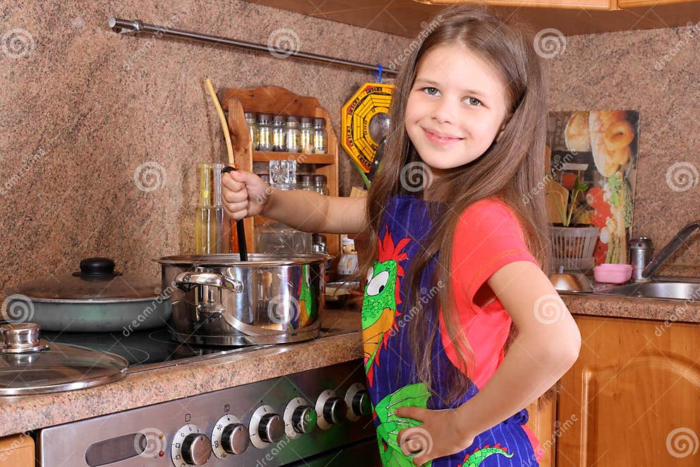 Girl cooking dinner stock photo. Image of boiling, boil - 14907238