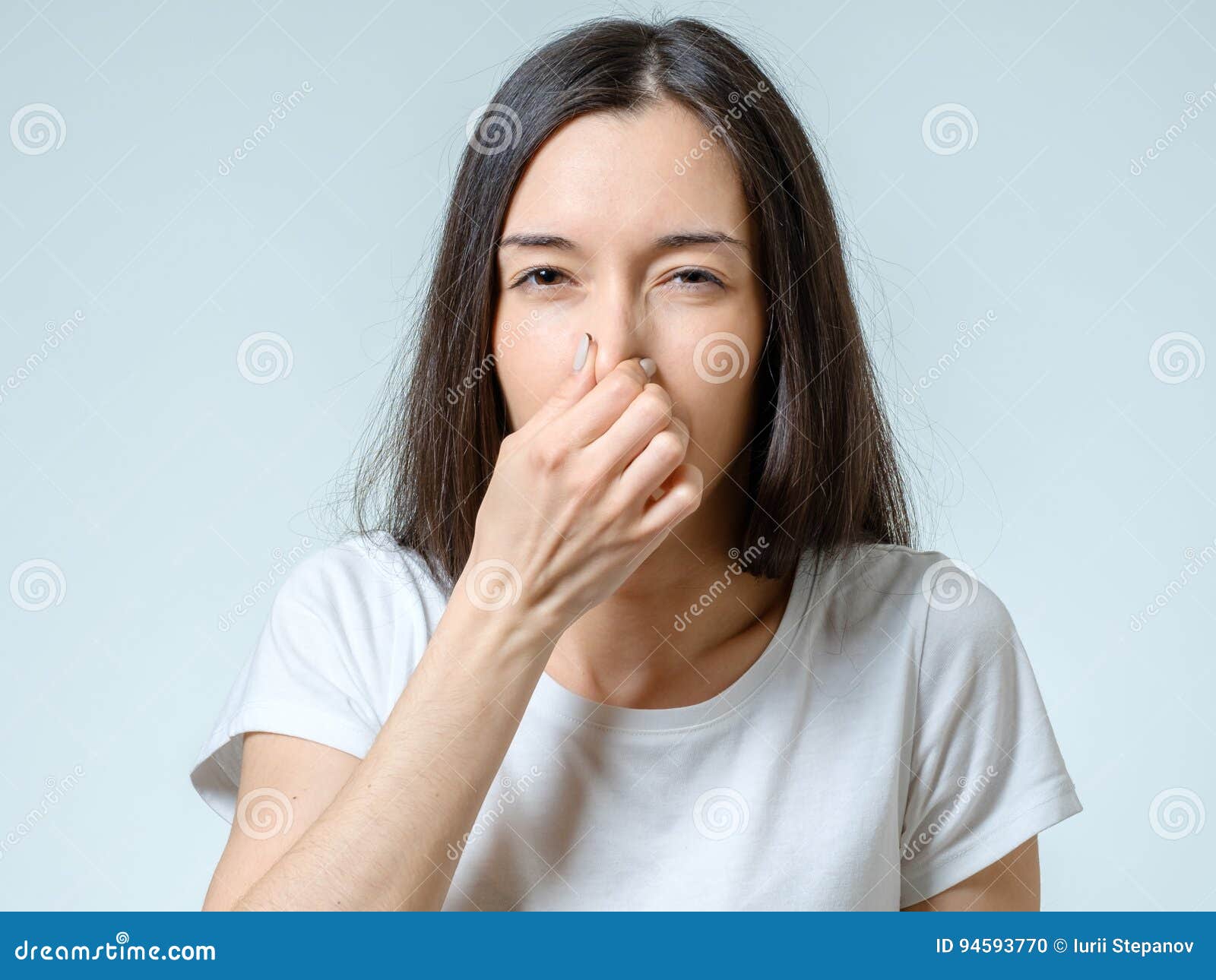 Girl Covers Nose with Hand Showing that Something Stinks Stock Photo ...