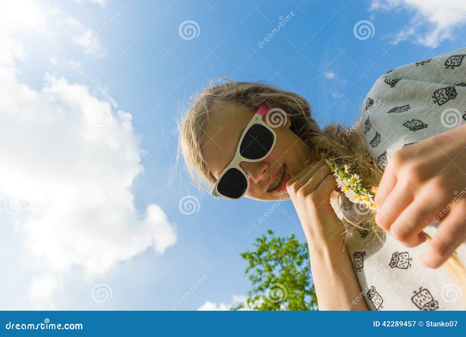 Girl with a daisy chain. stock image. Image of color - 42289457