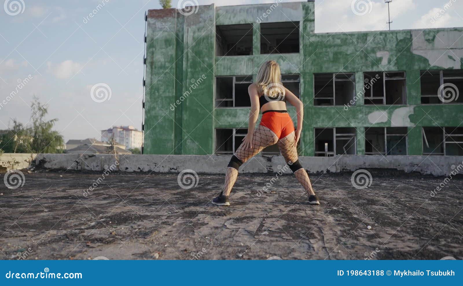 Girl Dances Twerk On The Roof Of An Abandoned Building Girl In Red Shorts And Tights In A Cell