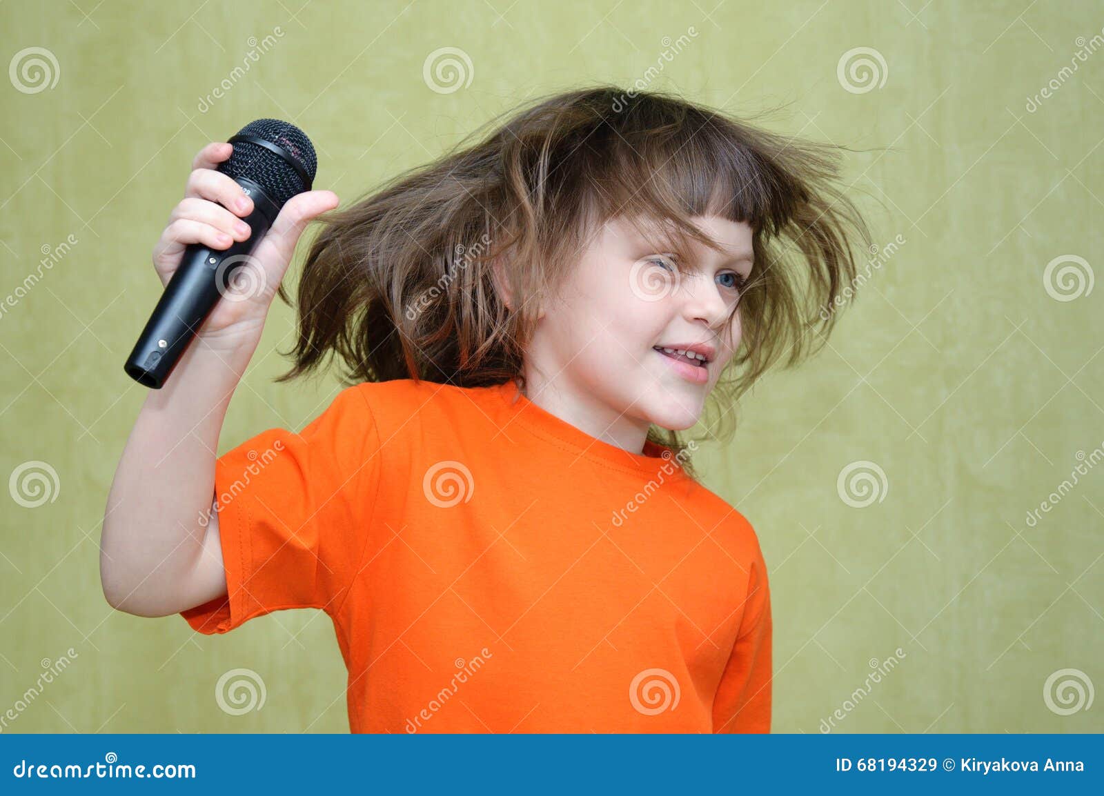 Girl Dancing with a Microphone in His Hands Stock Image - Image of ...