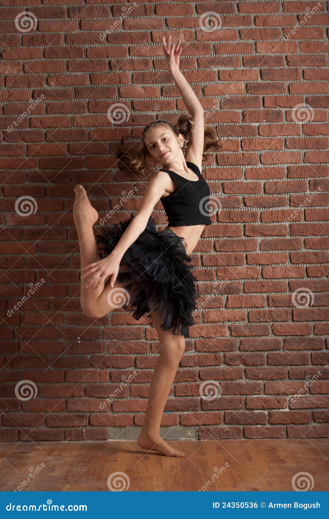 Girl Dancing Near Brick Wall Stock Photo - Image of music, movement ...