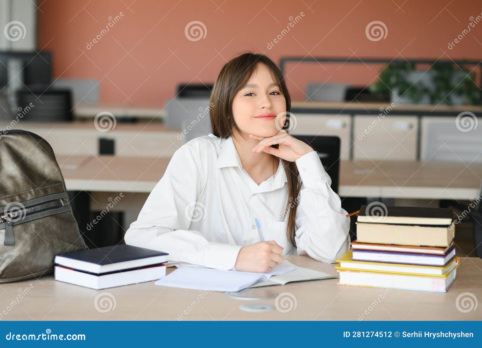Girl at the desk in school stock photo. Image of school - 281274512