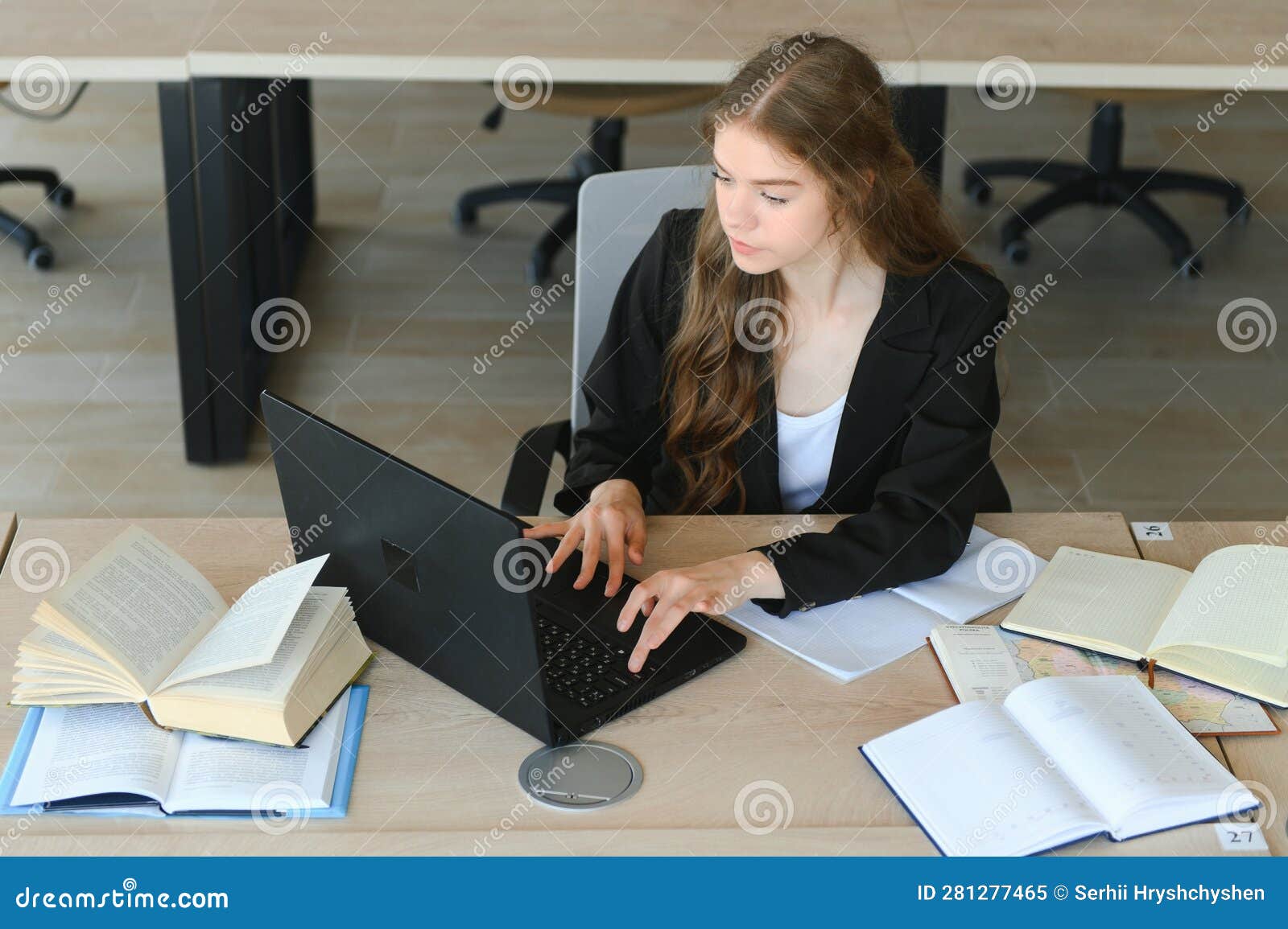 Girl at the desk in school stock image. Image of sitting - 281277465