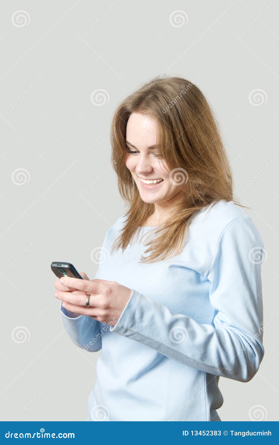 Girl dialing on cell phone stock image. Image of blue - 13452383