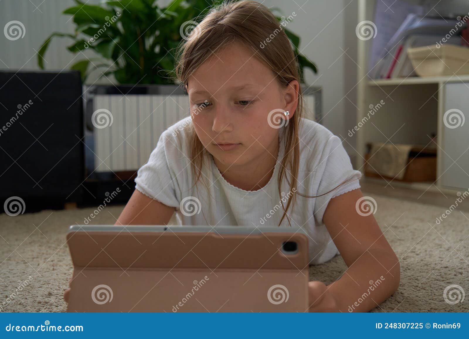 A Girl Does Her Homework on a Tablet Stock Image - Image of girl ...