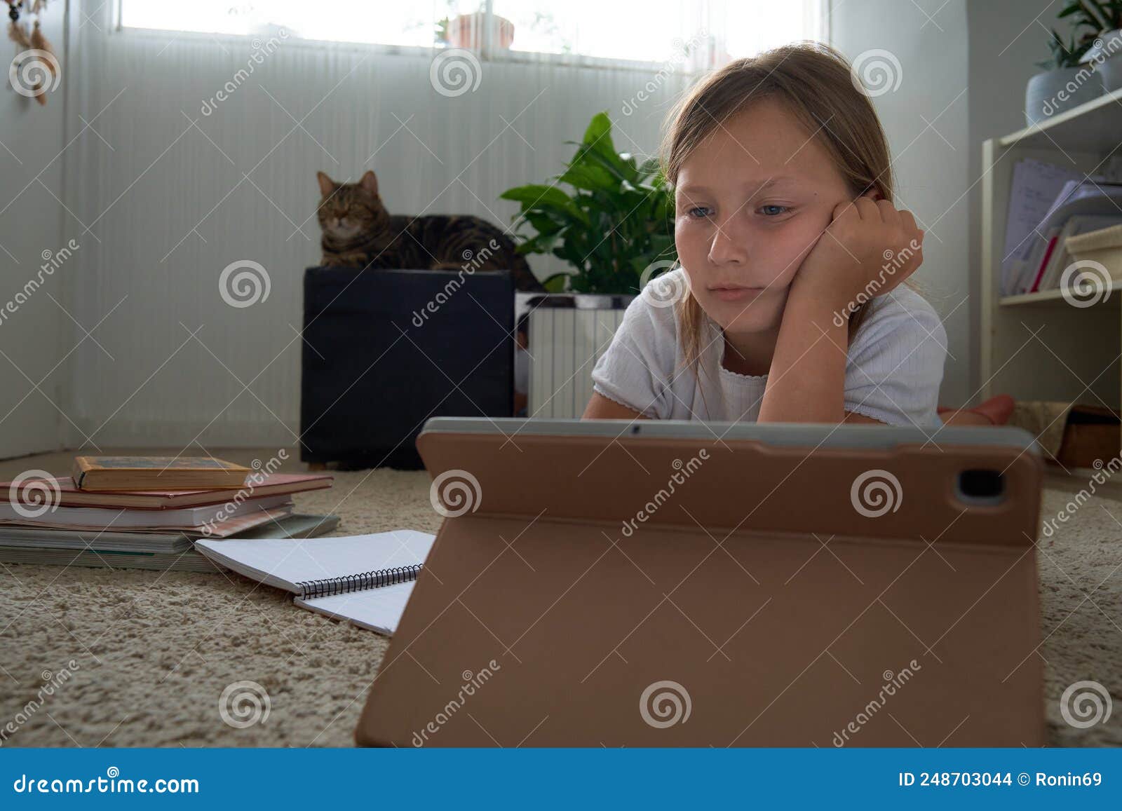 A Girl Does Her Homework on a Tablet Stock Photo - Image of laptop ...