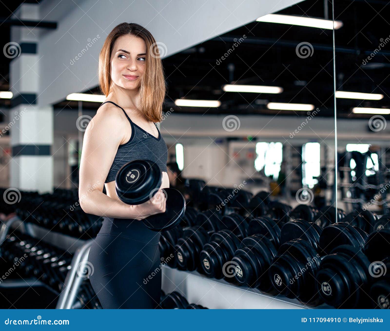 Girl Doing Bicep Exercise with Dumbbells Stock Photo - Image of female ...