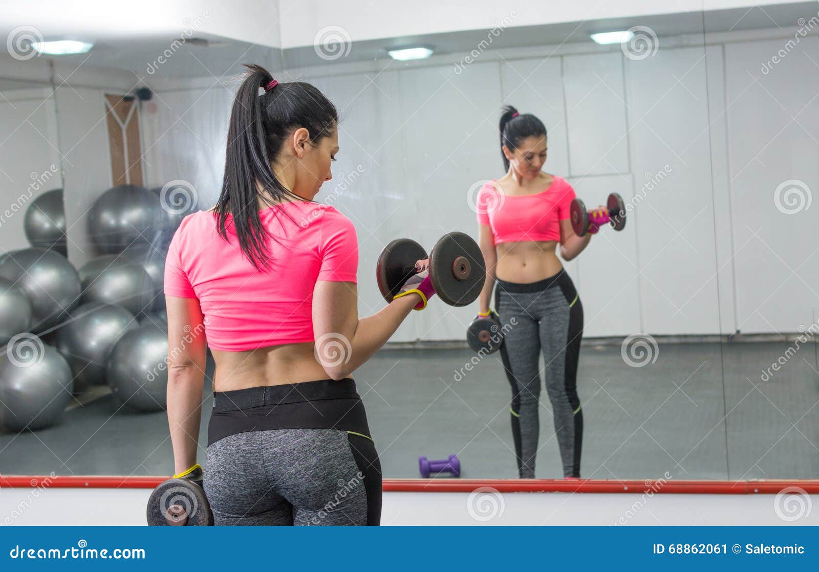 Girl doing biceps workout stock image. Image of girl - 68862061