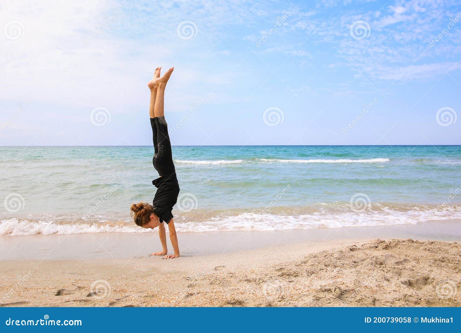 Girl Doing Gymnastics on Beach Stock Photo - Image of outdoor, physical ...