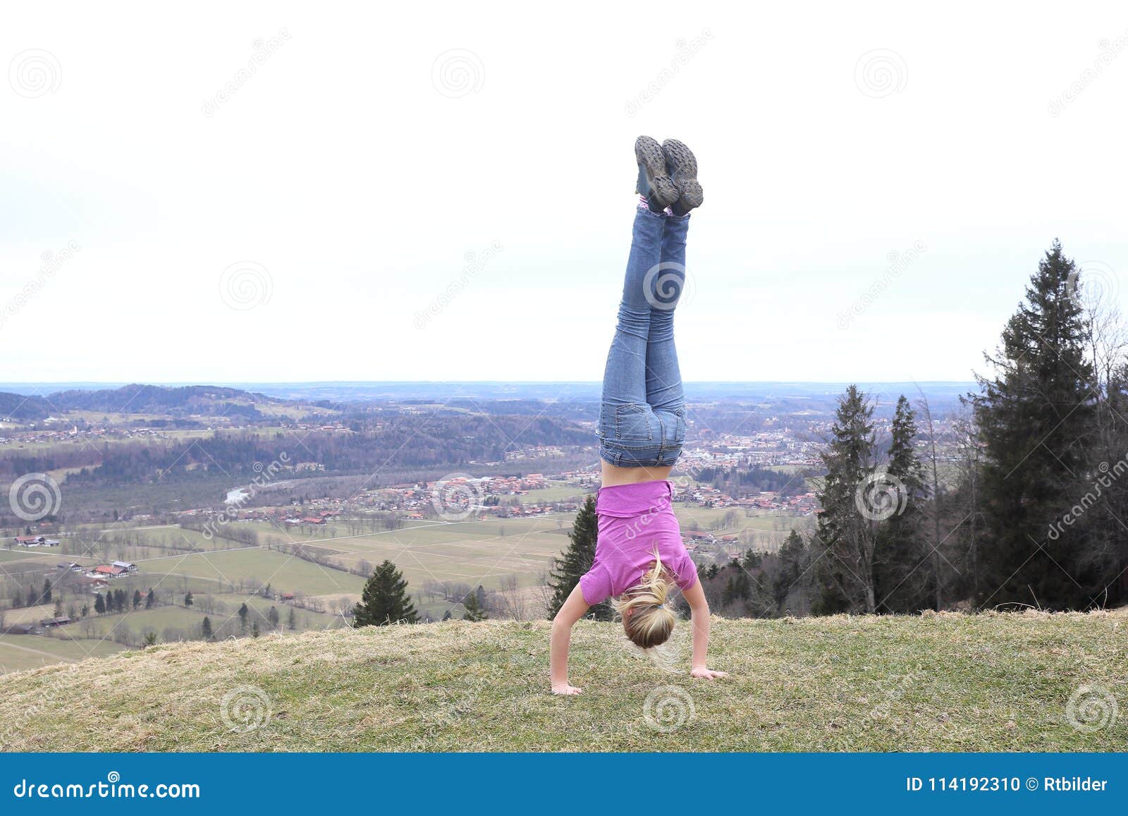 Girl is doing a handstand stock photo. Image of health - 114192310