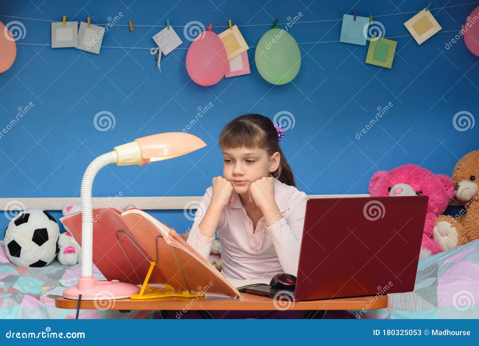 Girl Doing Homework at Home at the Table by the Bed Stock Image - Image ...