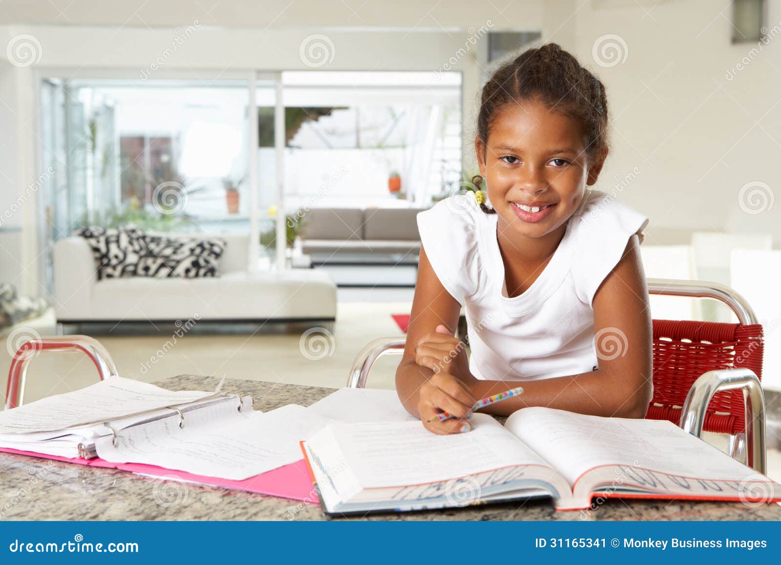 Girl Doing Homework in Kitchen Stock Image - Image of camera, looking ...