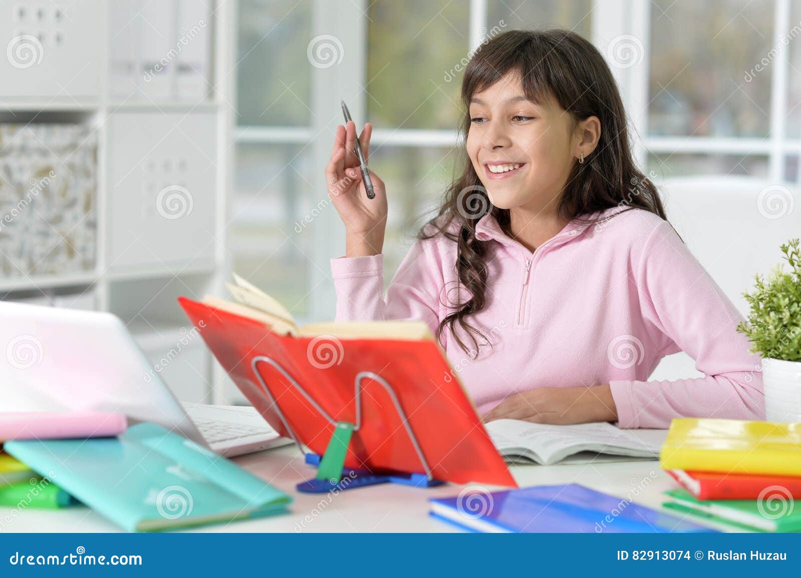 Girl doing homework stock photo. Image of individuality - 82913074