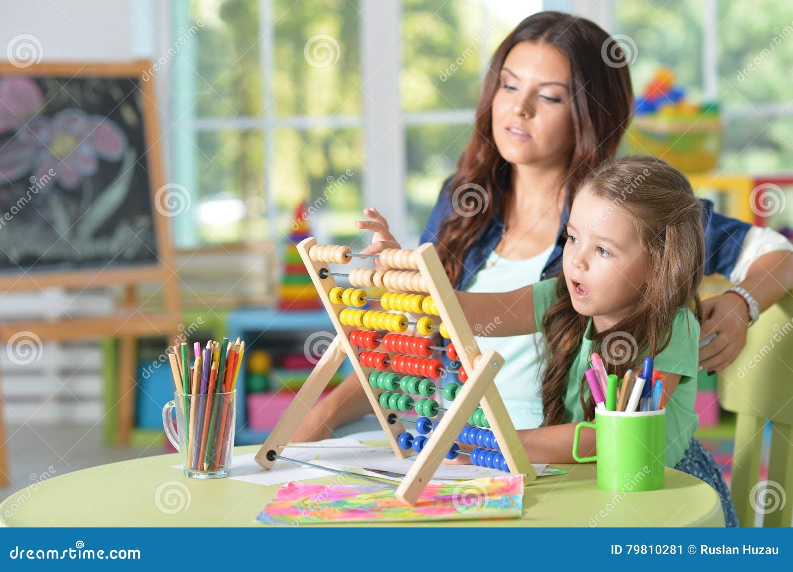 Girl doing math exercises stock image. Image of math - 79810281