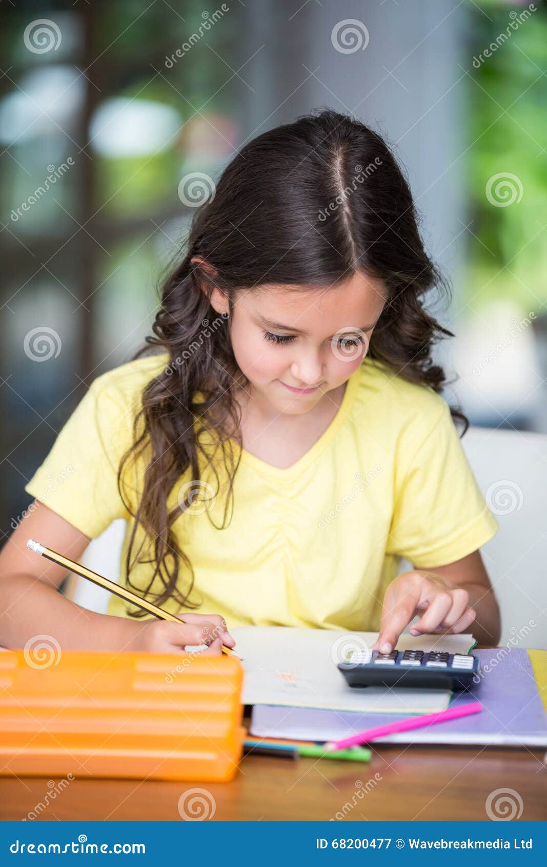 Girl doing math homework stock image. Image of education - 68200477