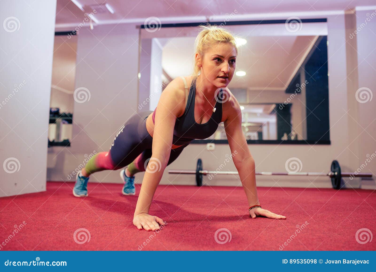 Girl doing push ups stock photo. Image of determination - 89535098