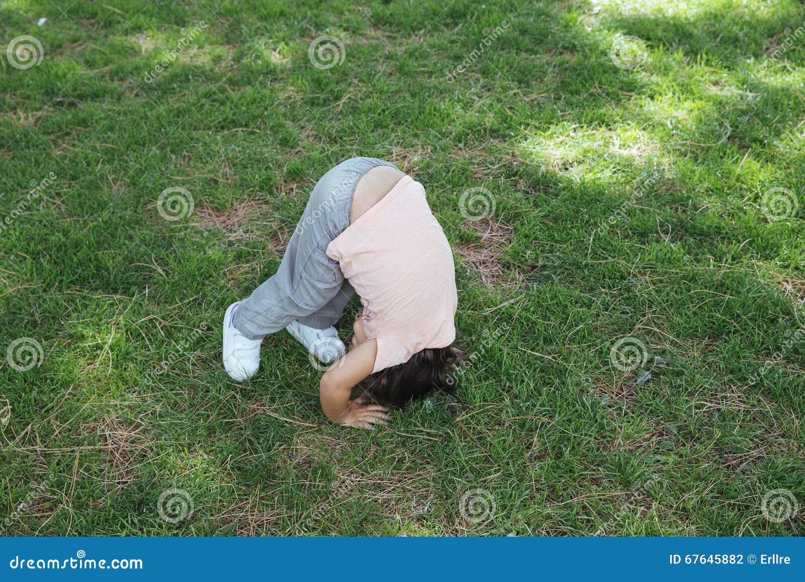 Girl Doing Somersault on Lawn Stock Photo - Image of motion, horizontal ...