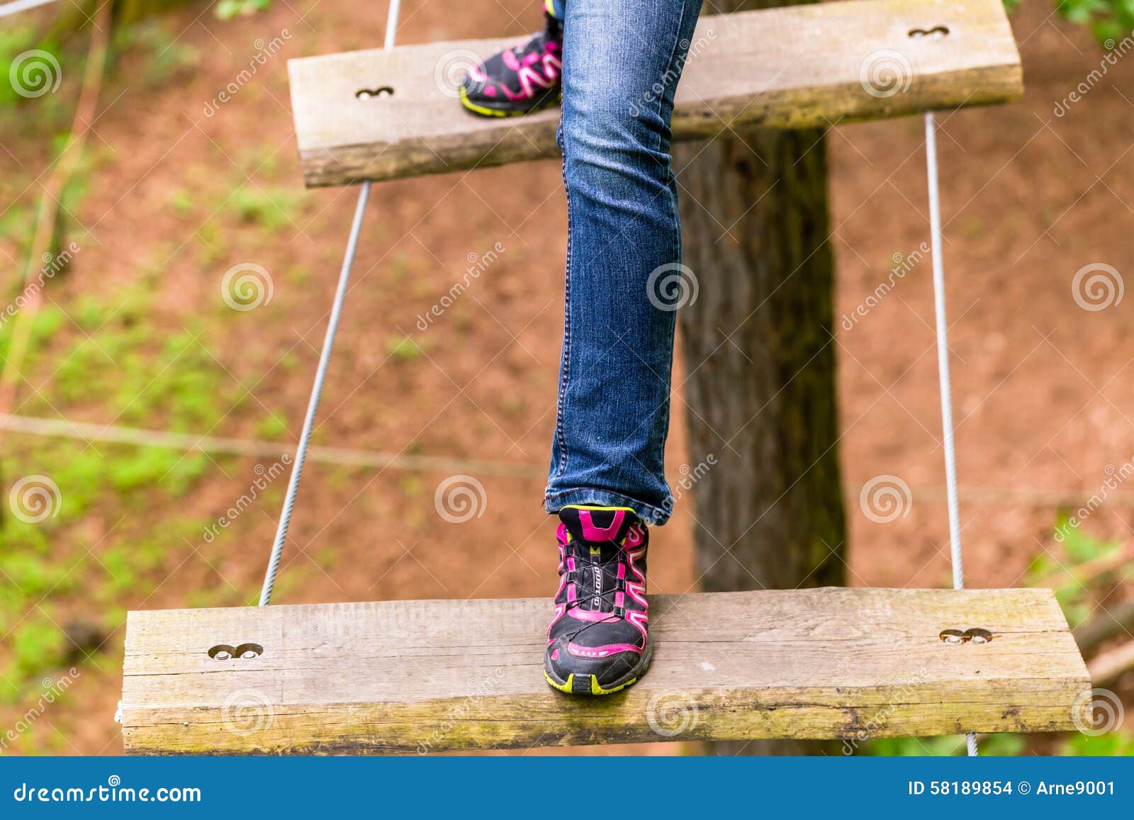 Girl Doing Step on Rope Bridge Stock Photo - Image of caucasian, nature ...