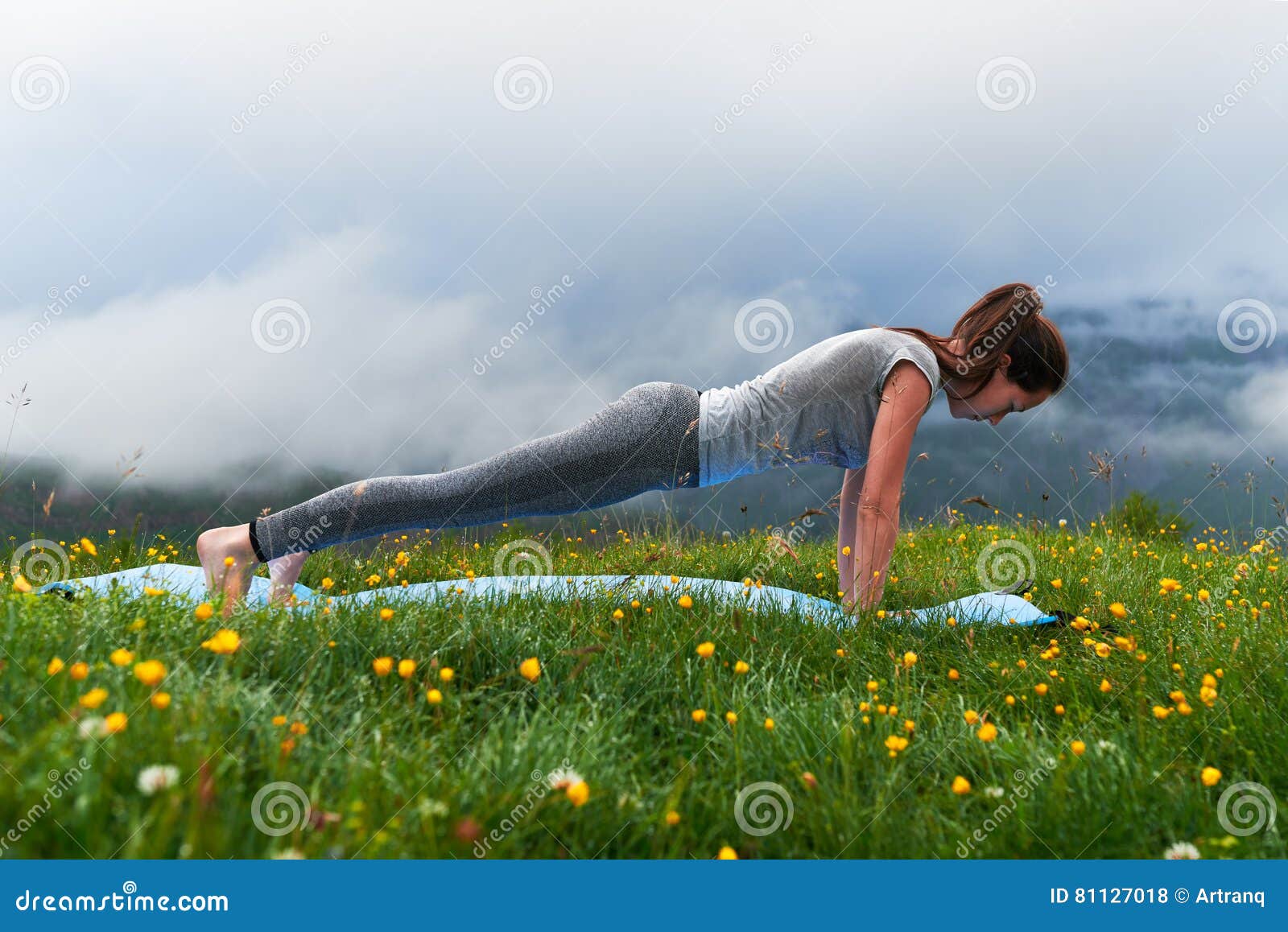 Girl Doing Yoga Exercise Strap on the Lawn in Mountains Stock Photo ...
