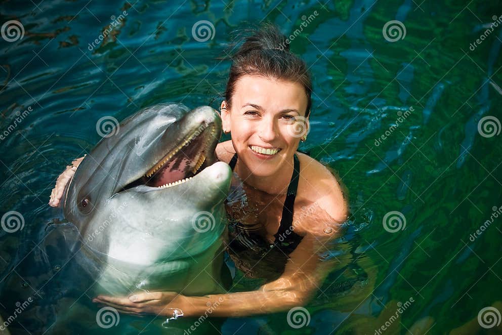 Girl and dolphin stock photo. Image of recreational, dolphin - 18543320