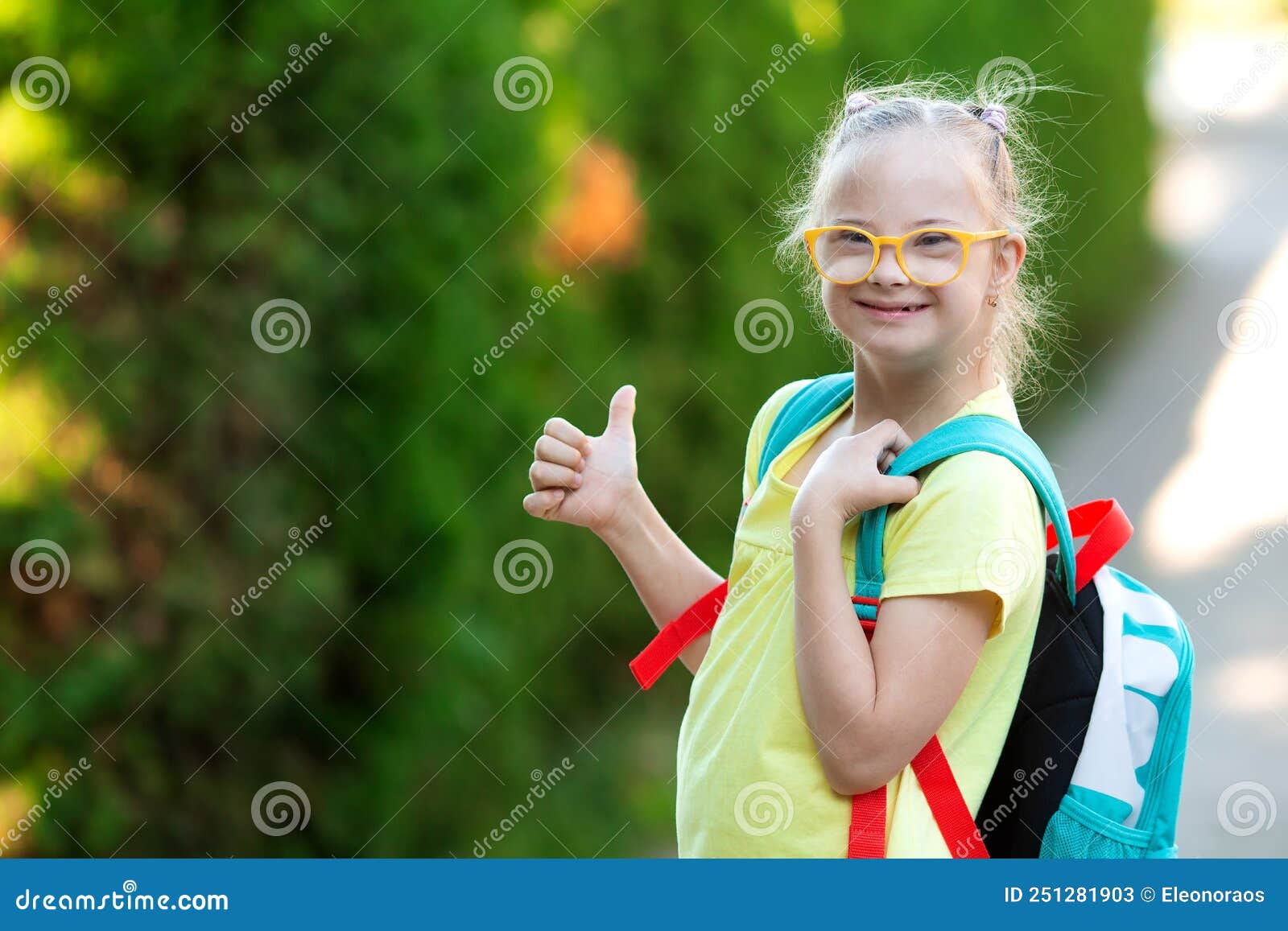 A Girl with Down Syndrome Goes To School with a Backpack Stock Image ...