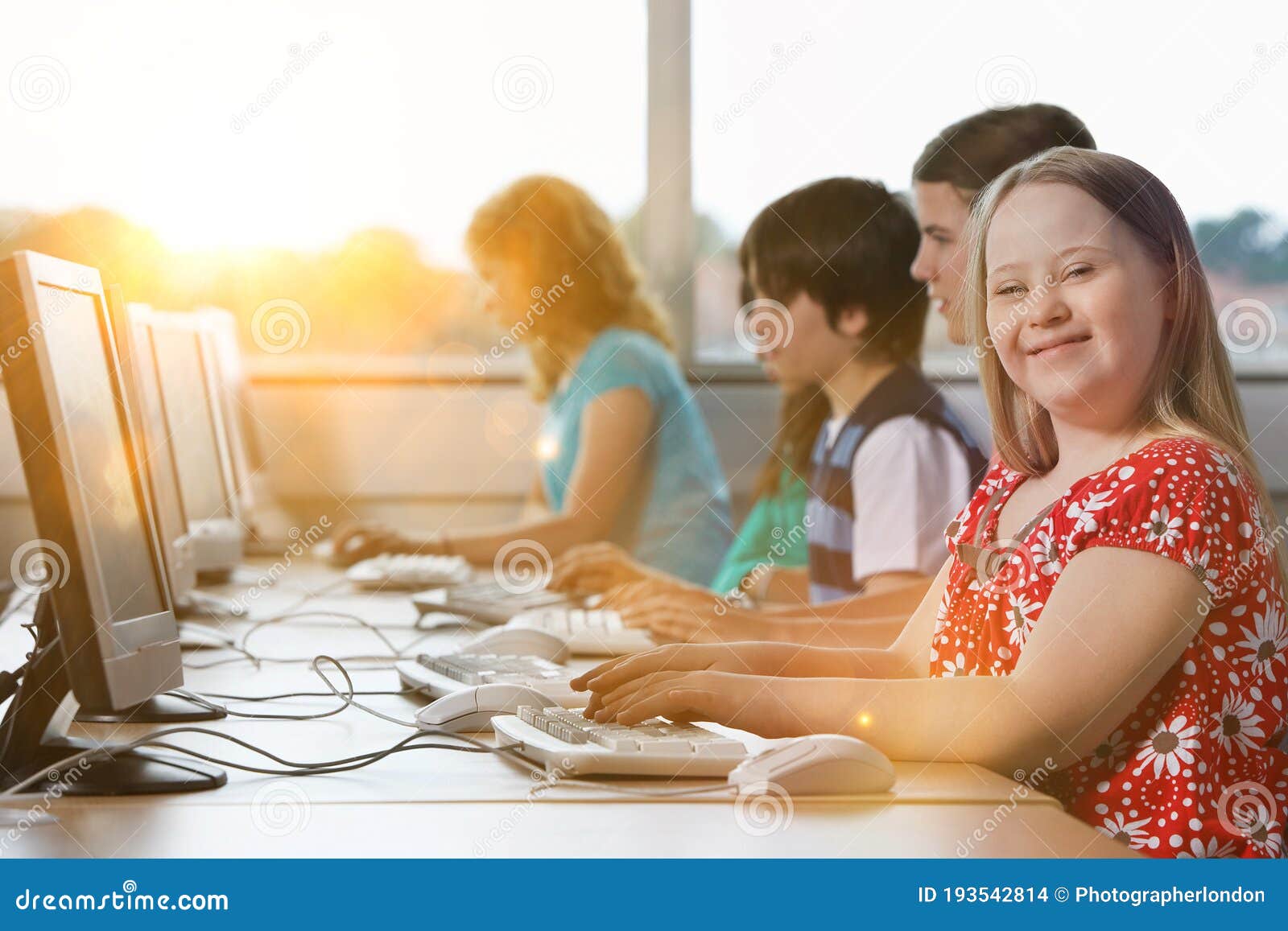 Girl with Down Syndrome Using Computer at School Stock Photo - Image of ...
