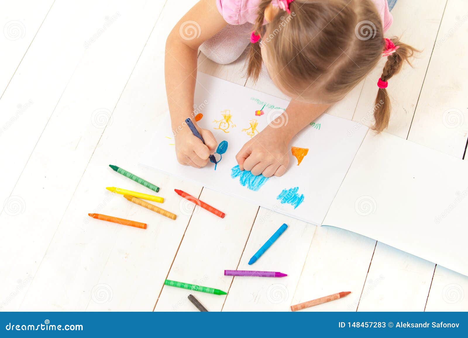 The Girl Draws with Crayons in the Album Stock Image - Image of ...