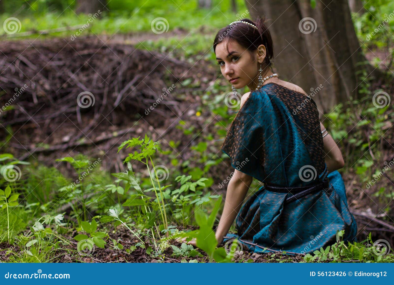 Girl in Dress Sitting in the Forest Stock Photo - Image of green ...