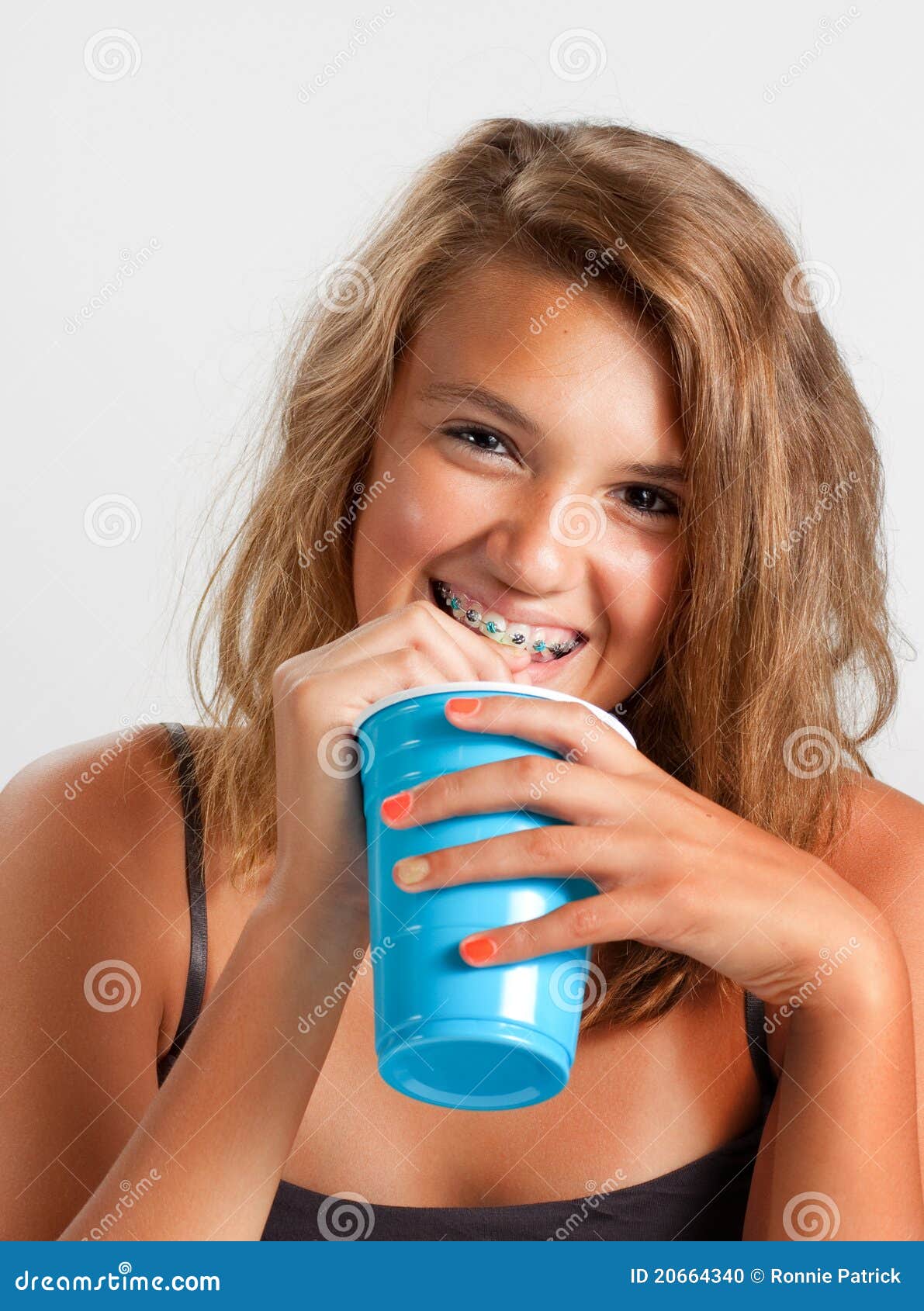 Girl Drinking from Blue Cup Stock Photo - Image of smile, young: 20664340