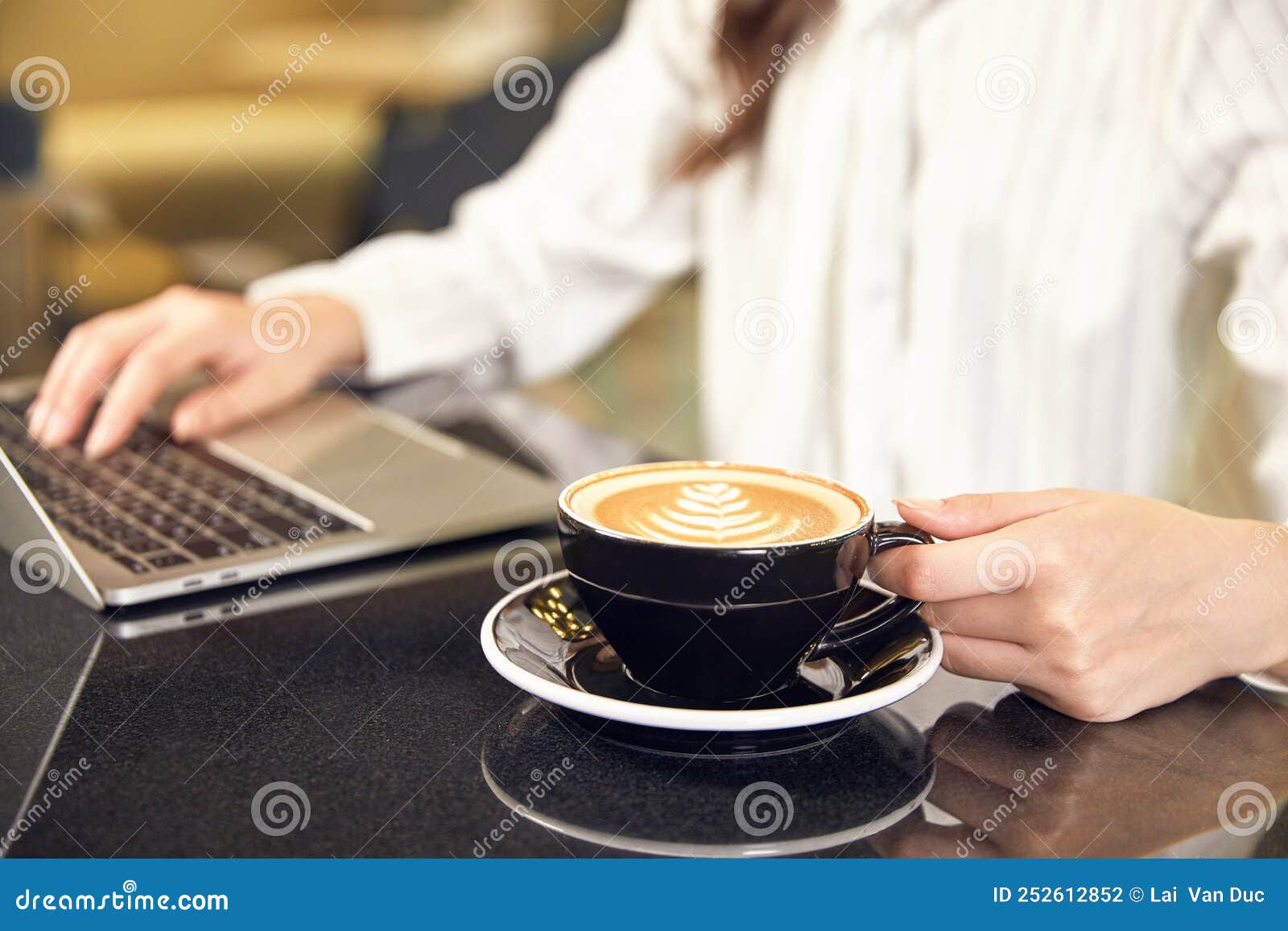 Girl Drinking Coffee while Working on the Computer in the Office Stock ...