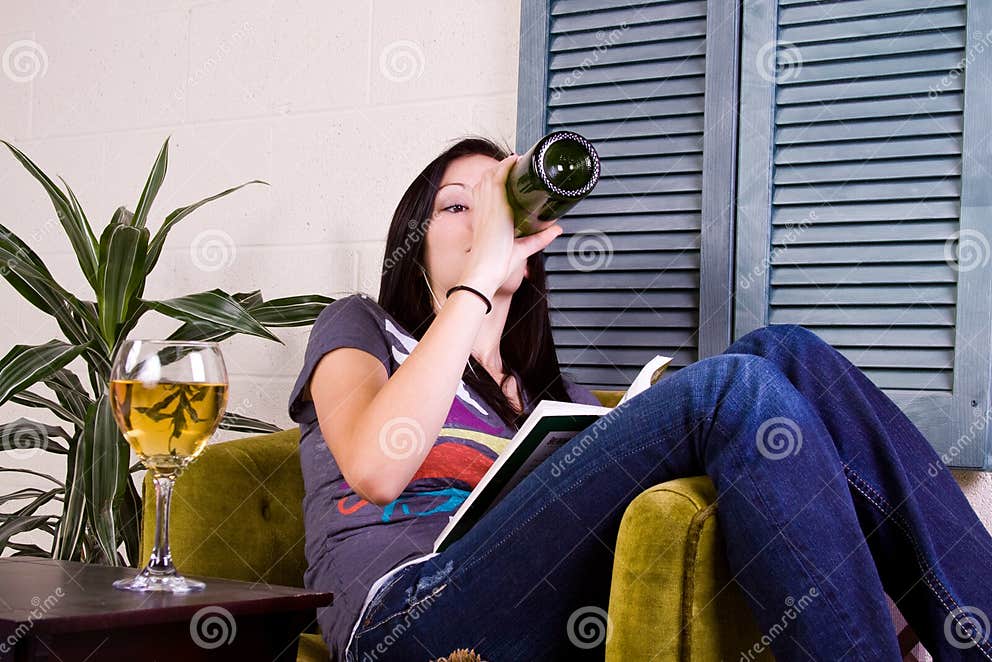 Girl Drinking while Reading a Book Stock Image - Image of beauty, music ...