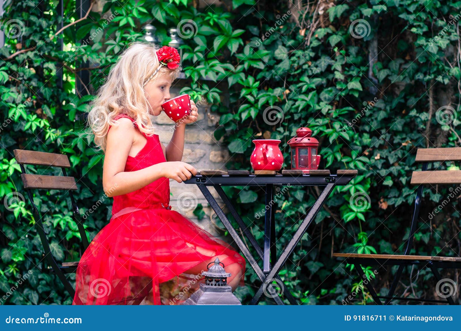 Girl drinking tea stock image. Image of portrait, garden - 91816711