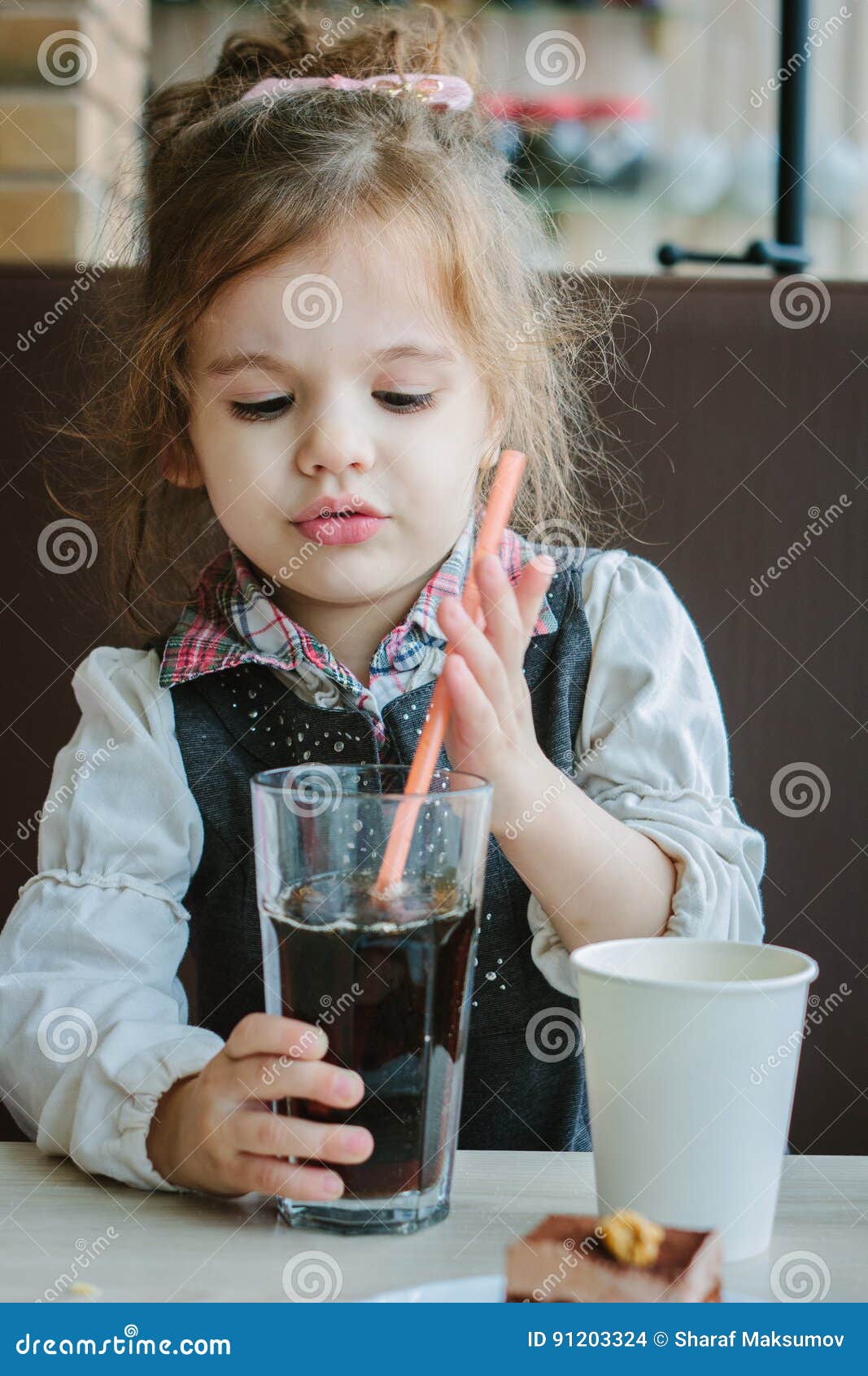 Girl drinks cola stock photo. Image of cute, cafe, little - 91203324